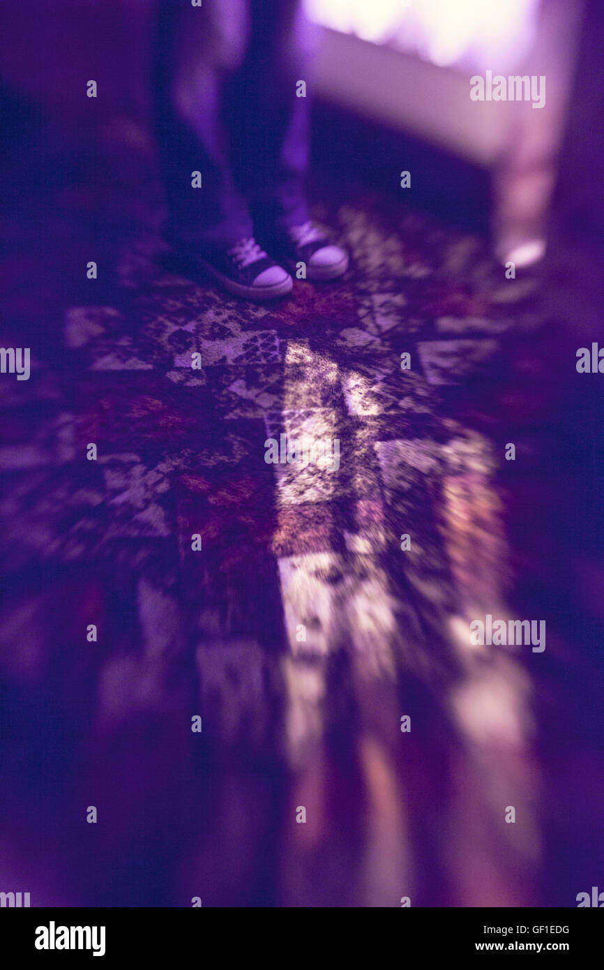 Photograph of person from knees down standing at the window Stock Photo ...