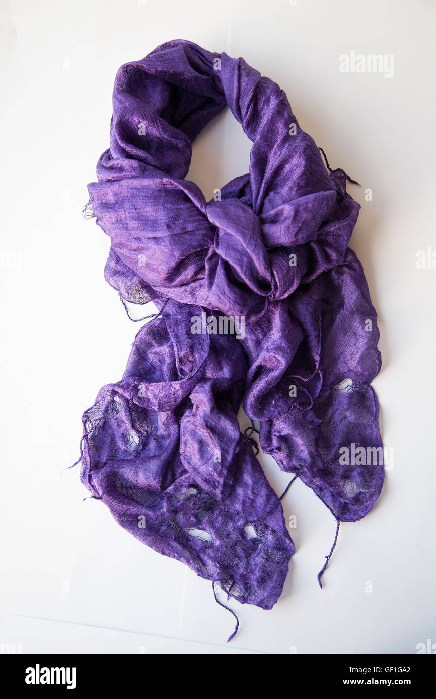 Torn and worn purple silk scarf Stock Photo - Alamy