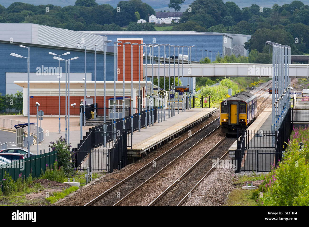 Commuter train passing Buckshaw Parkway, new northern railway station ...