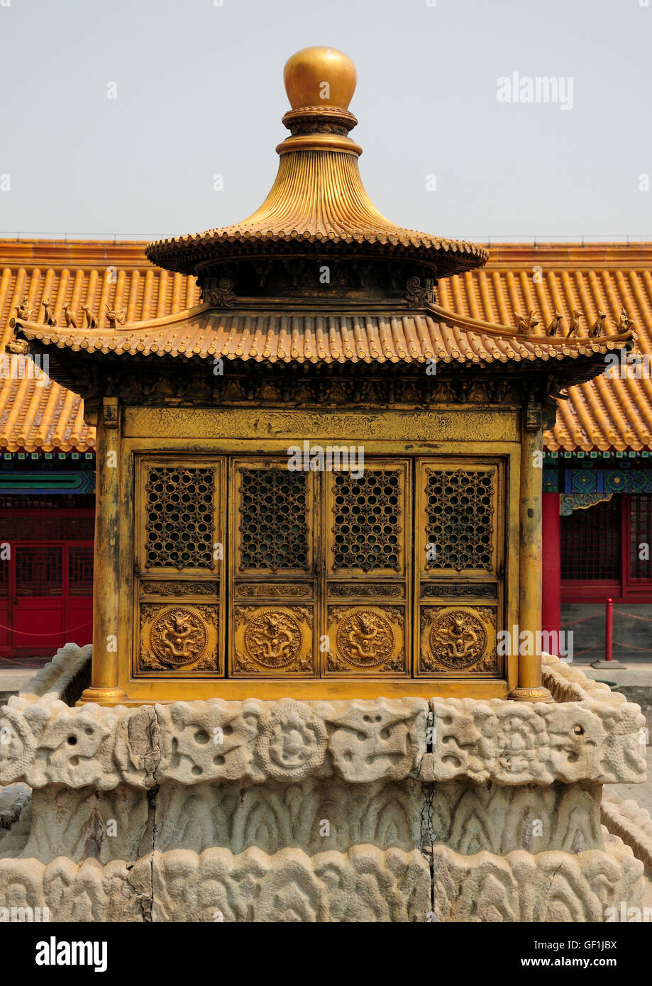A large brass prayer shrine covered in dragons within the Forbidden ...
