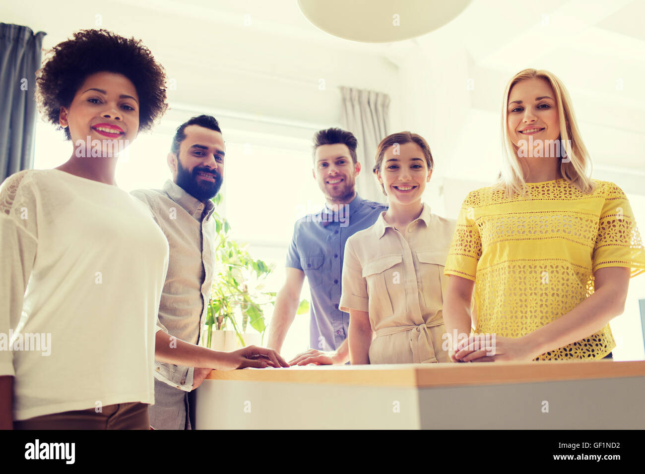 happy creative team in office Stock Photo - Alamy