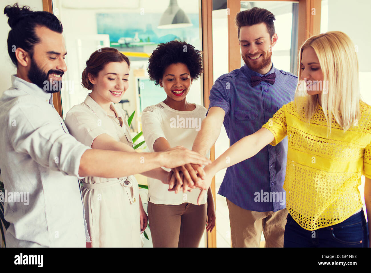 happy creative team in office Stock Photo - Alamy