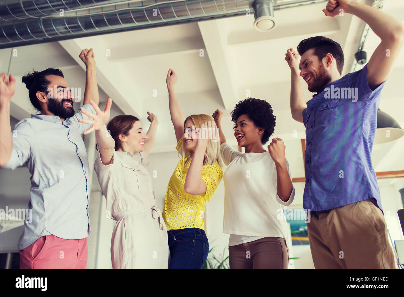 Happy designers celebrating success in hi-res stock photography and ...