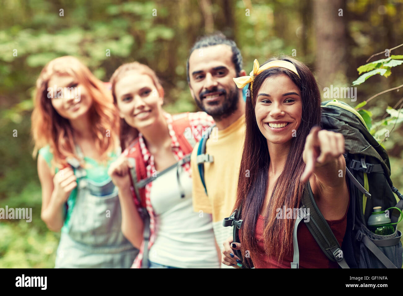 group of smiling friends with backpacks hiking Stock Photo - Alamy