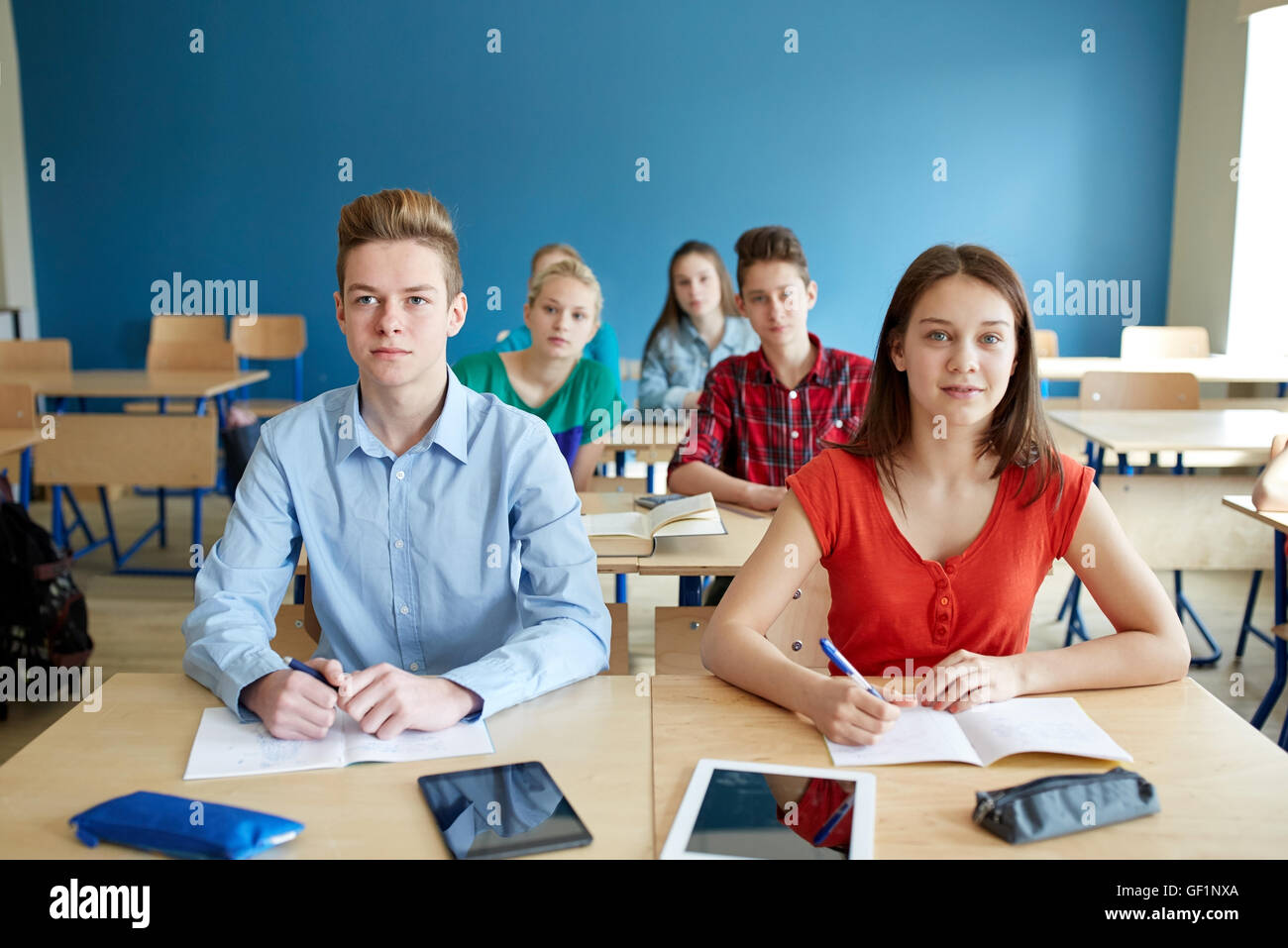 students with notebooks and tablet pc at school Stock Photo - Alamy