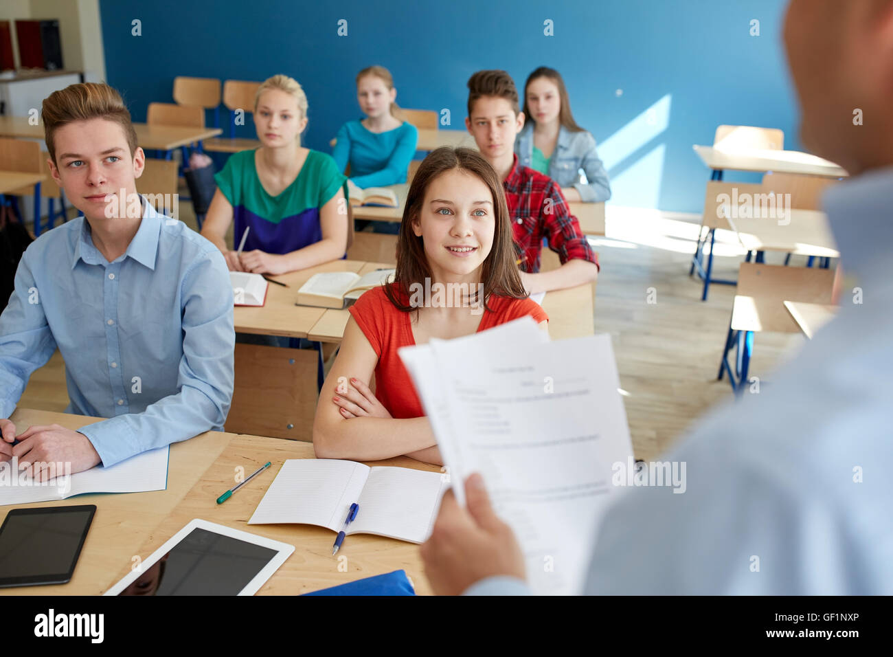 group of students and teacher with papers or tests Stock Photo - Alamy