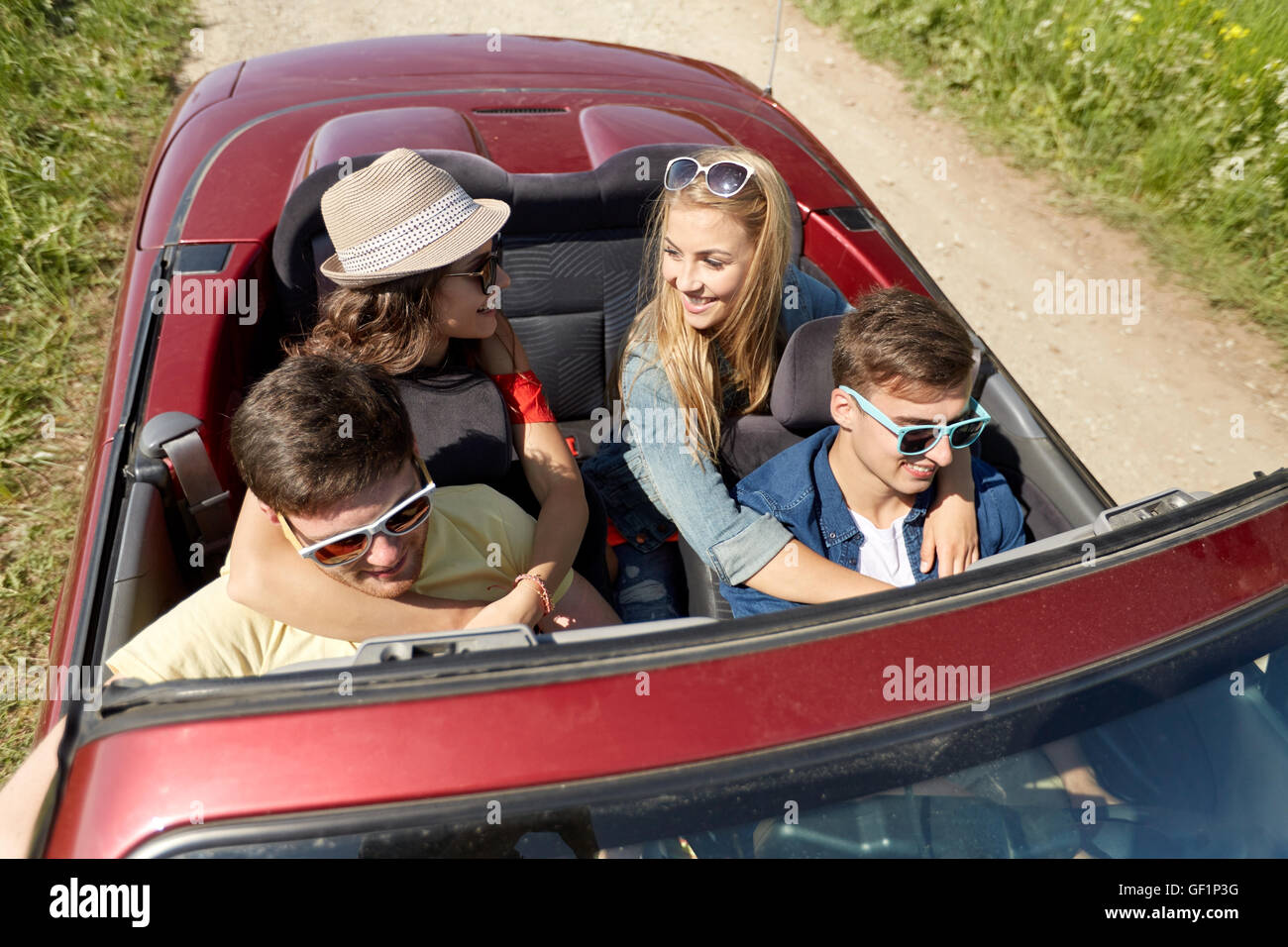 happy friends driving in cabriolet car at country Stock Photo - Alamy
