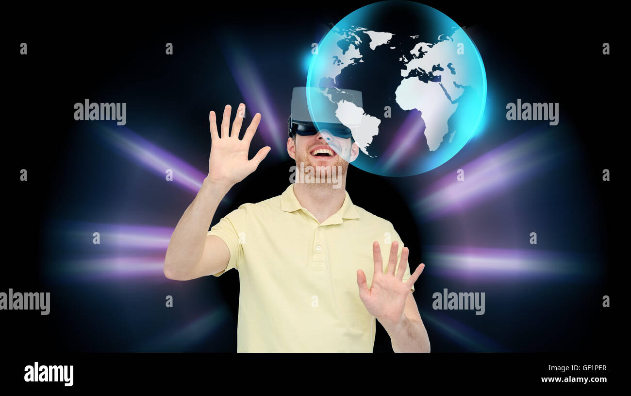 happy man in virtual reality headset or 3d glasses Stock Photo - Alamy