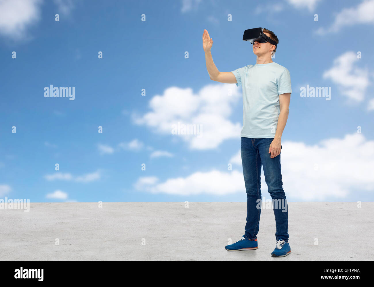 happy man in virtual reality headset or 3d glasses Stock Photo - Alamy