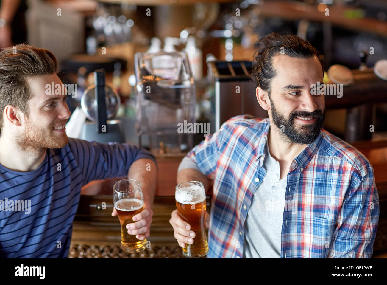 happy male friends drinking beer at bar or pub Stock Photo - Alamy