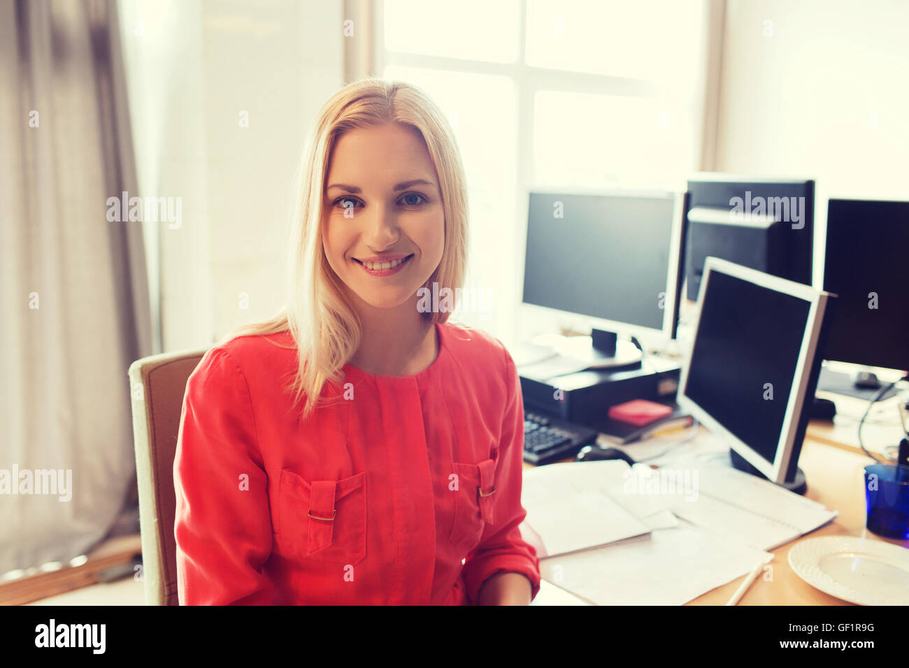 happy creative female office worker with computers Stock Photo - Alamy