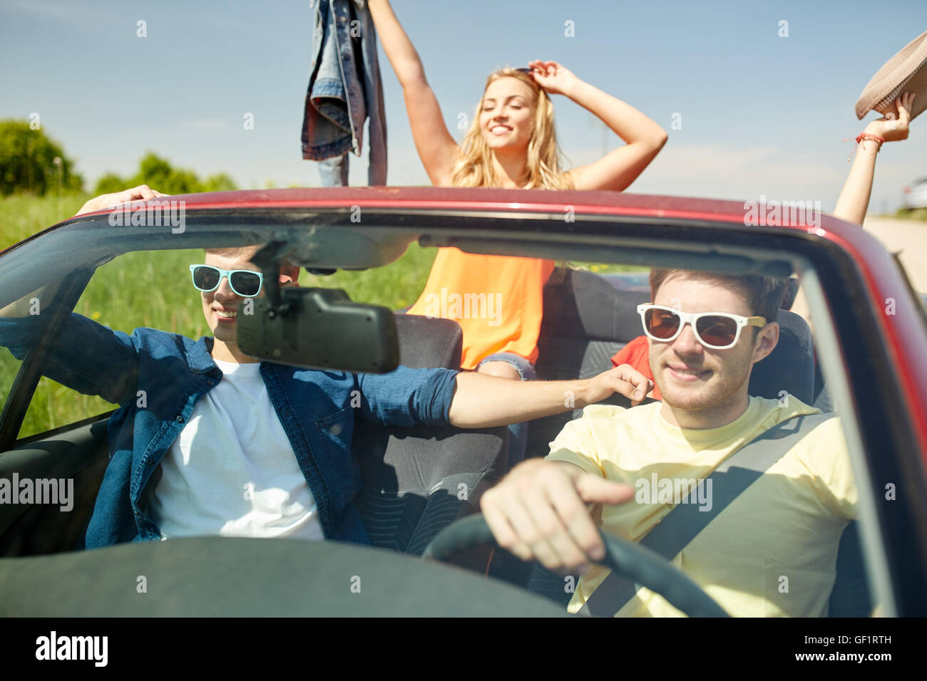 happy friends driving in cabriolet car Stock Photo - Alamy