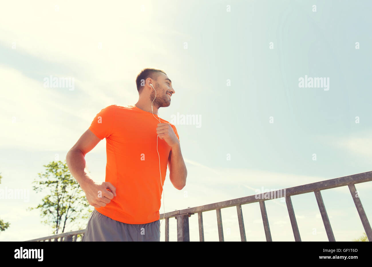 Man running smiling outside hi-res stock photography and images - Alamy