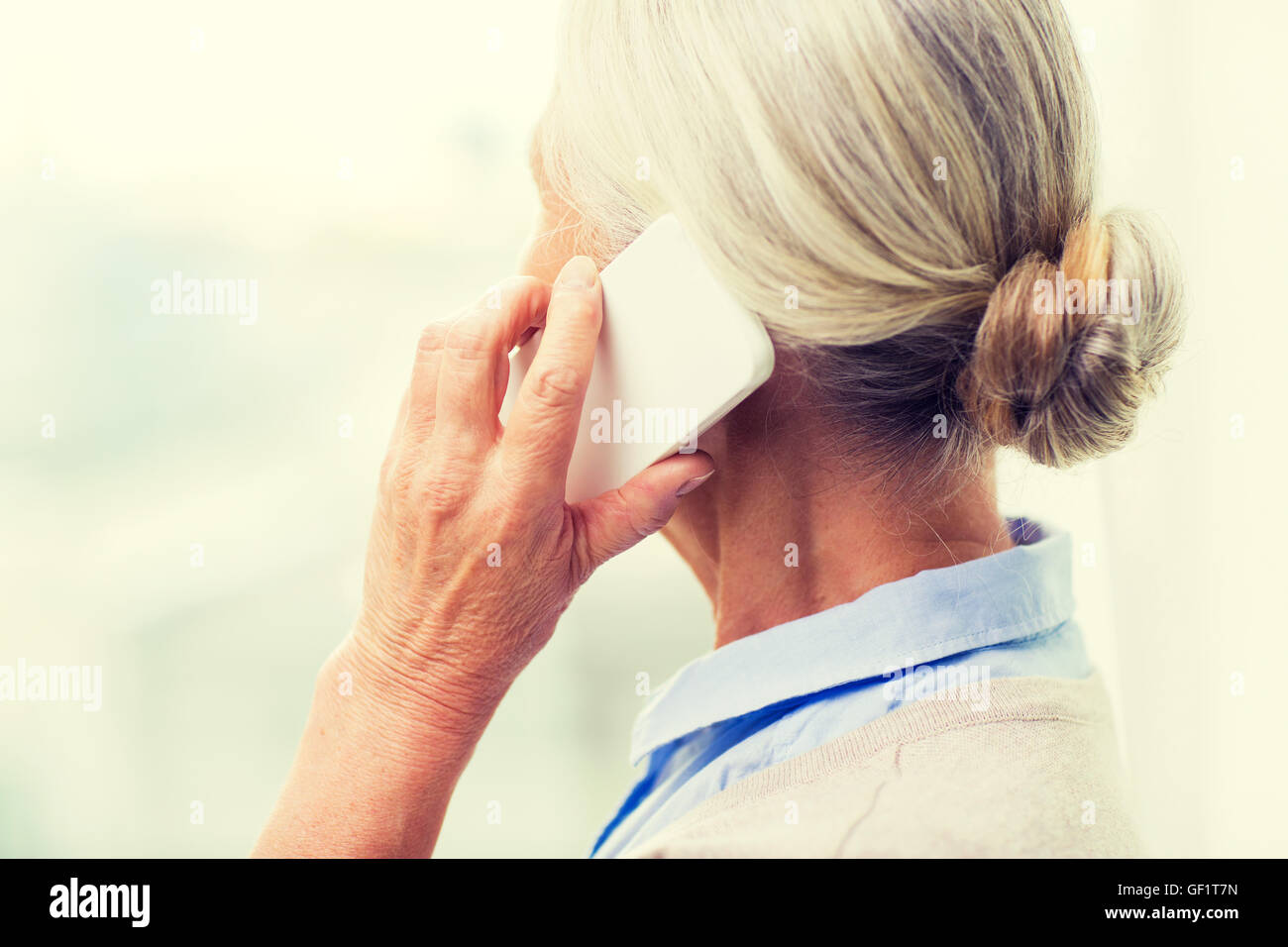 Grandmother on phone back hi-res stock photography and images - Alamy