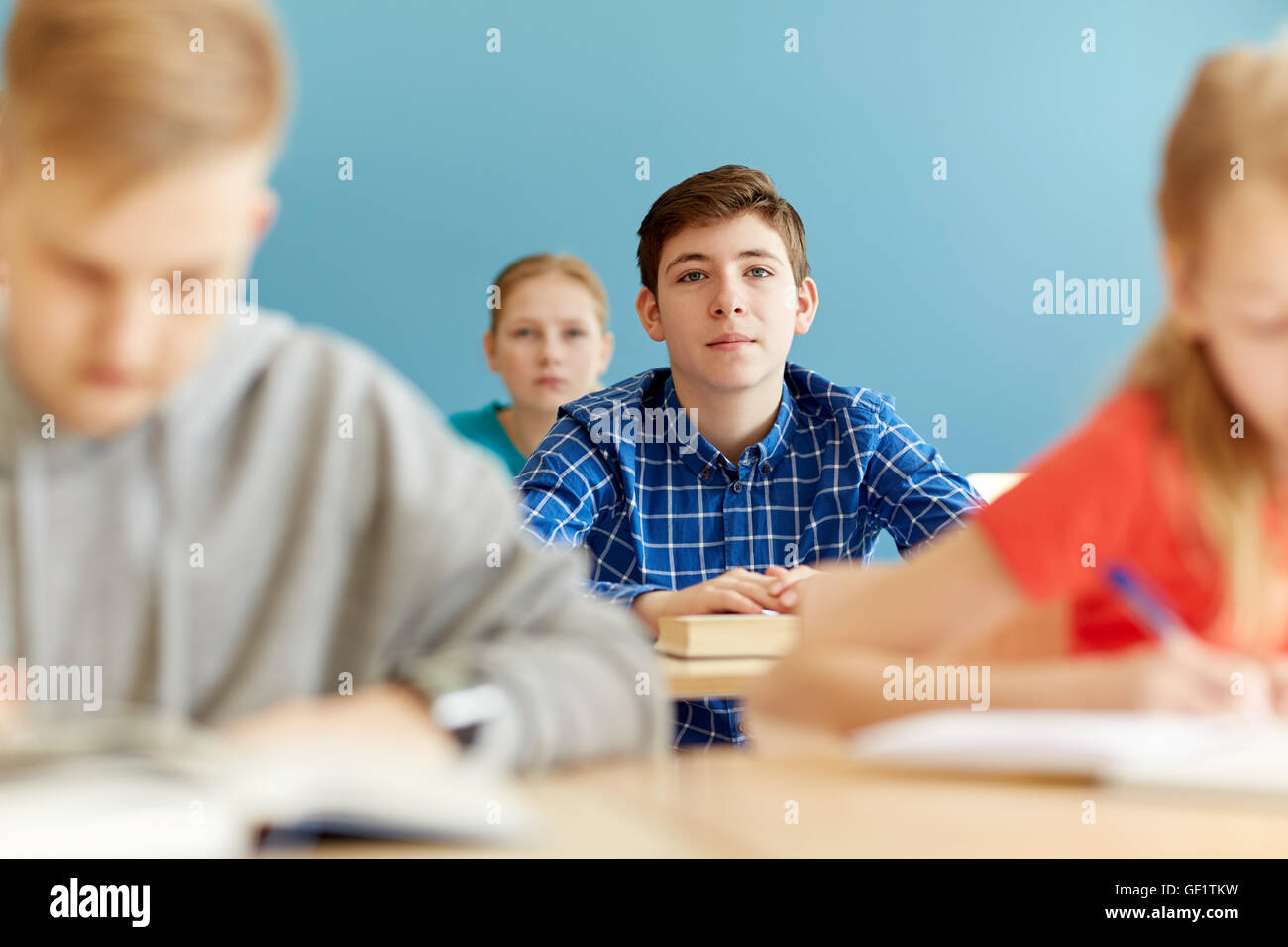 group of students with notebooks at school lesson Stock Photo - Alamy