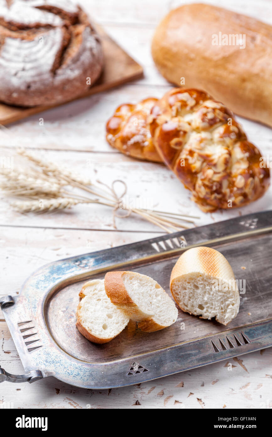 Delicious freshly baked bread on wooden background Stock Photo - Alamy
