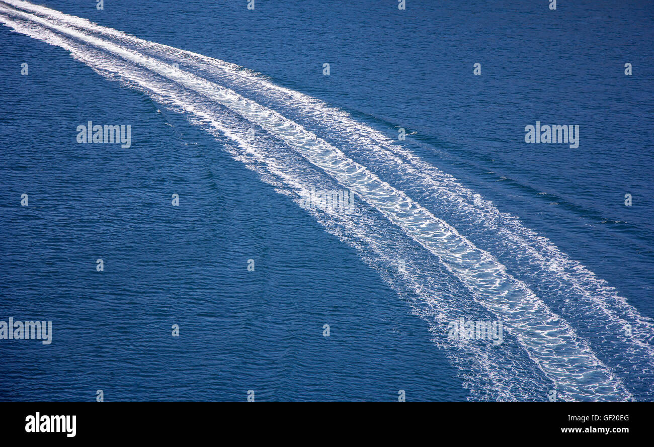 Trail on sea surface behind of speed boats Stock Photo - Alamy