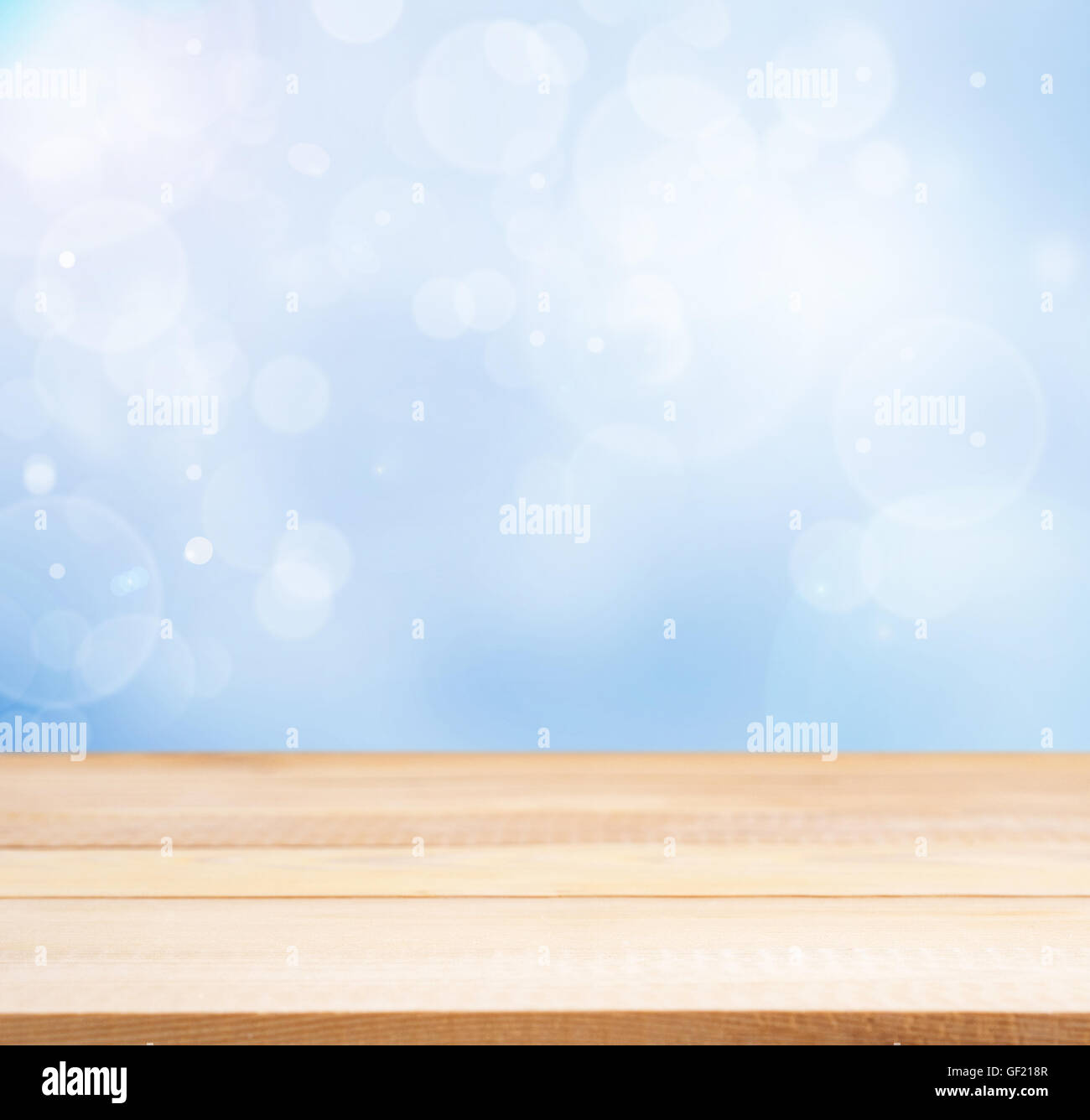 Wooden empty table in abstract blue background Stock Photo - Alamy