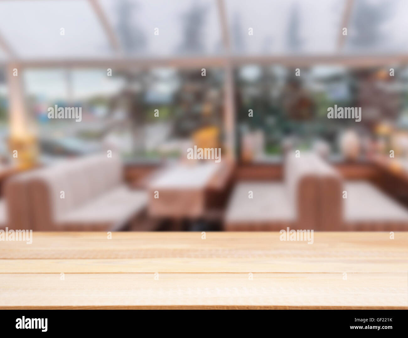 Wooden board empty table in front of blurred cafe Stock Photo - Alamy