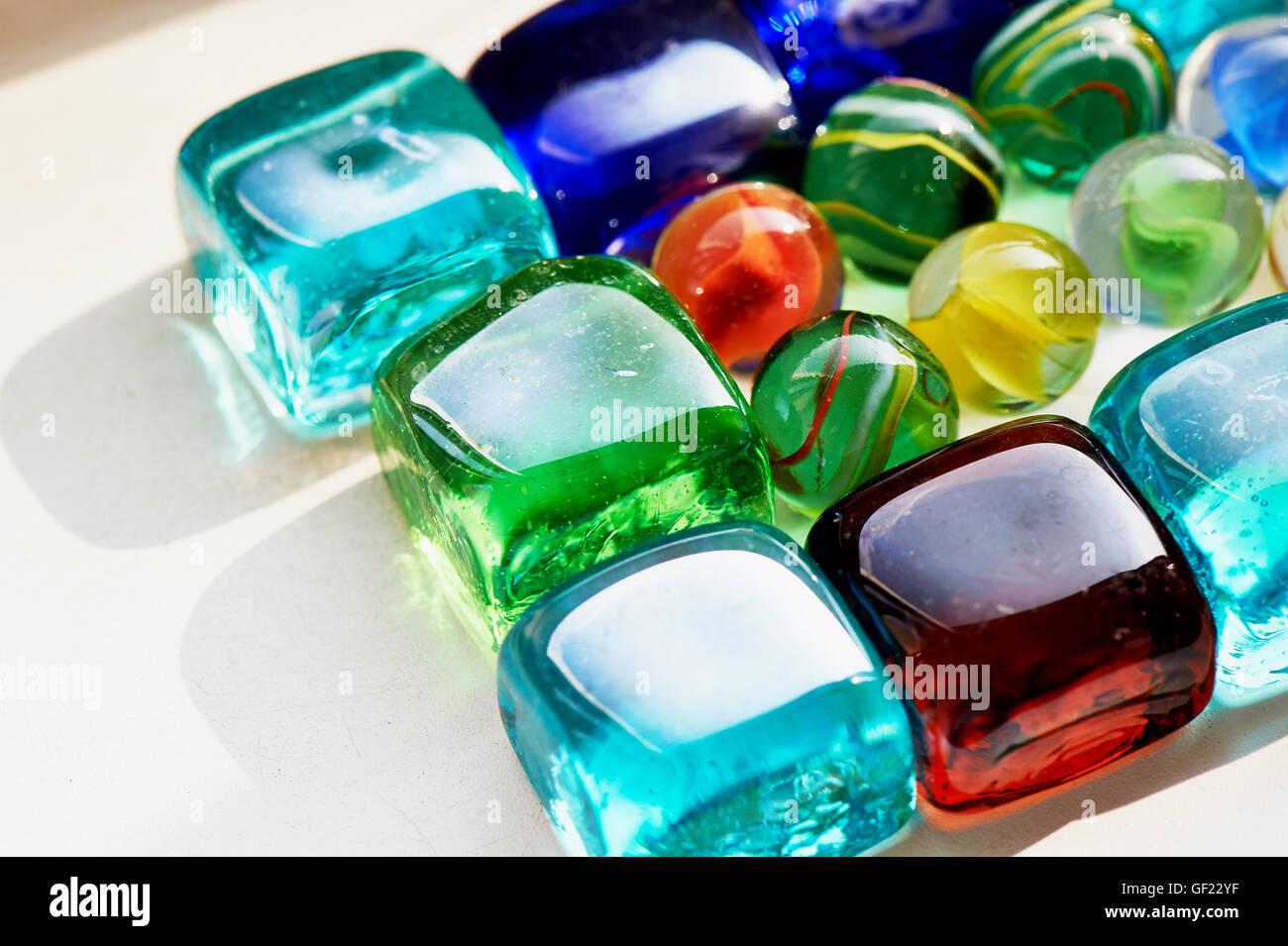 Colorful glass colorful square and round stones. Macro Stock Photo - Alamy