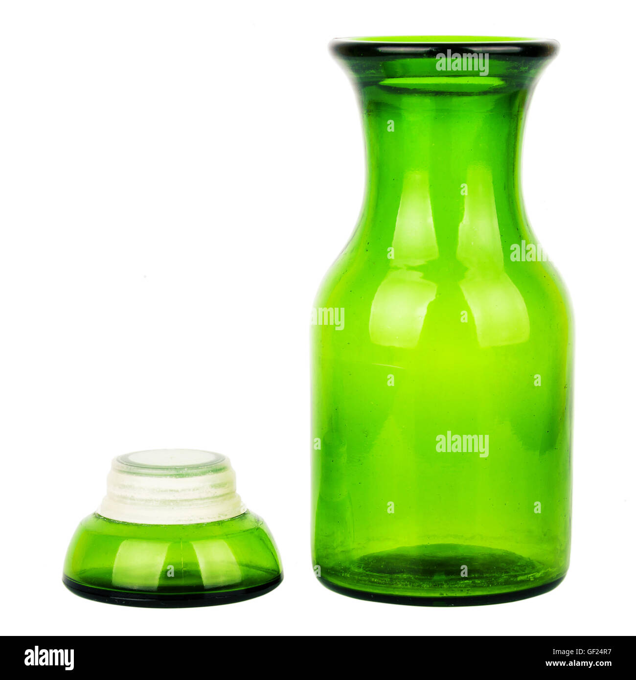 Green glass chemical bottle with the ground stopper isolated on white ...