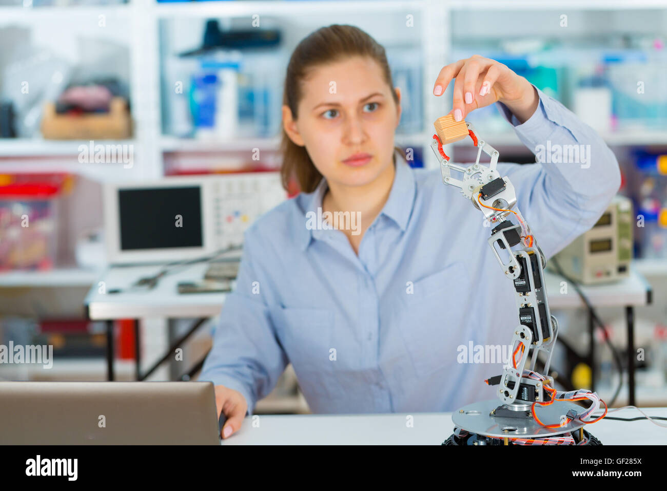 Scientist develops Software for the robot arm Stock Photo - Alamy