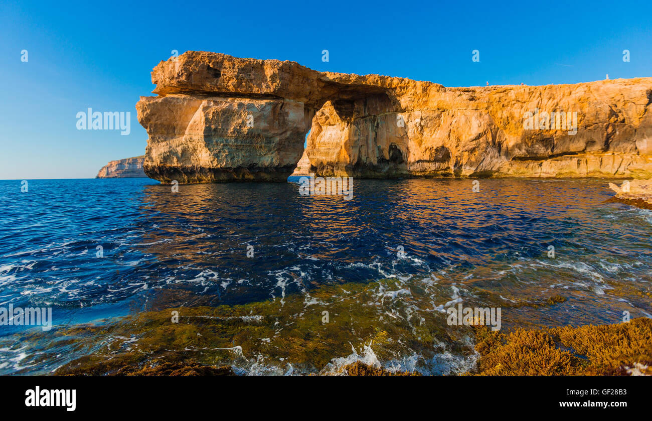 Azure Window, famous stone arch on Gozo island with reflection, Malta ...