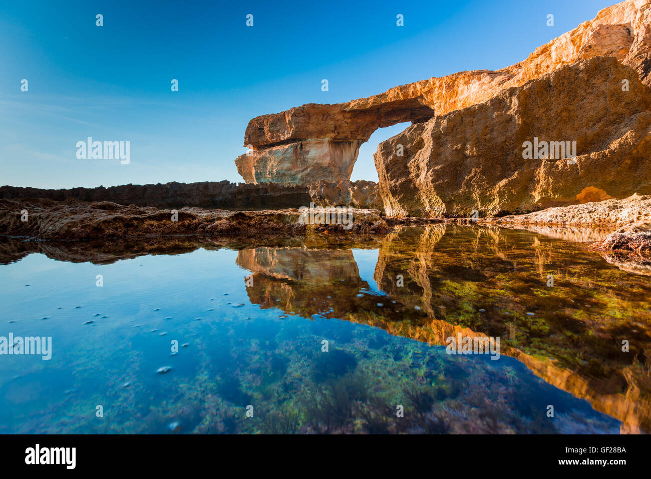 Azure Window, famous stone arch on Gozo island with reflection, Malta ...