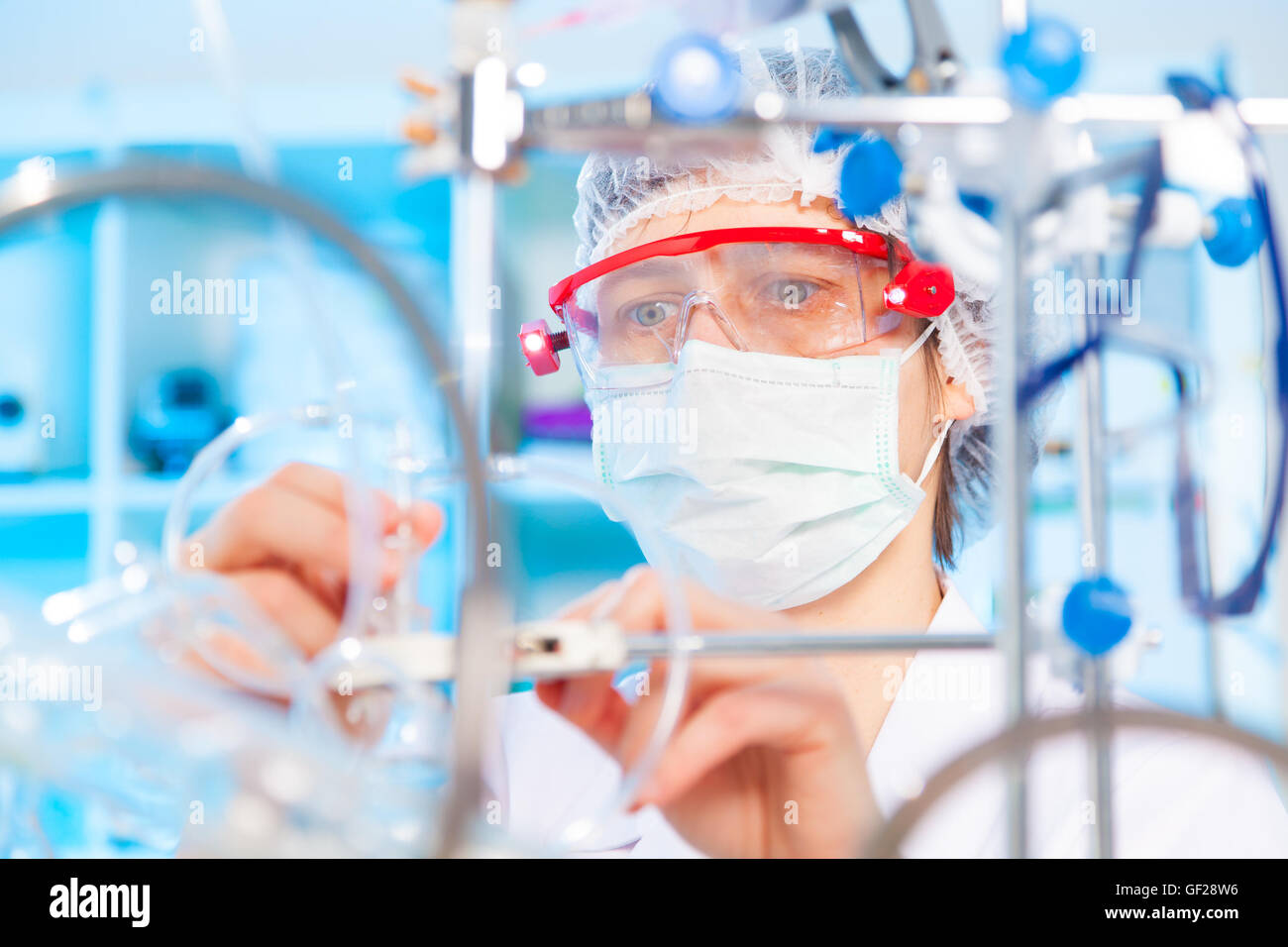 Woman factory worker operating machine hi-res stock photography and ...