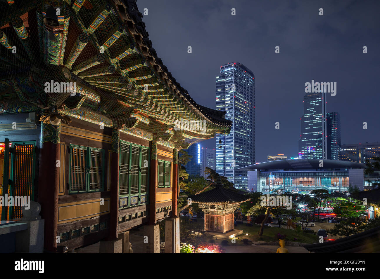 Ornate building at the Bongeunsa Temple and view of Gangnam in Seoul ...