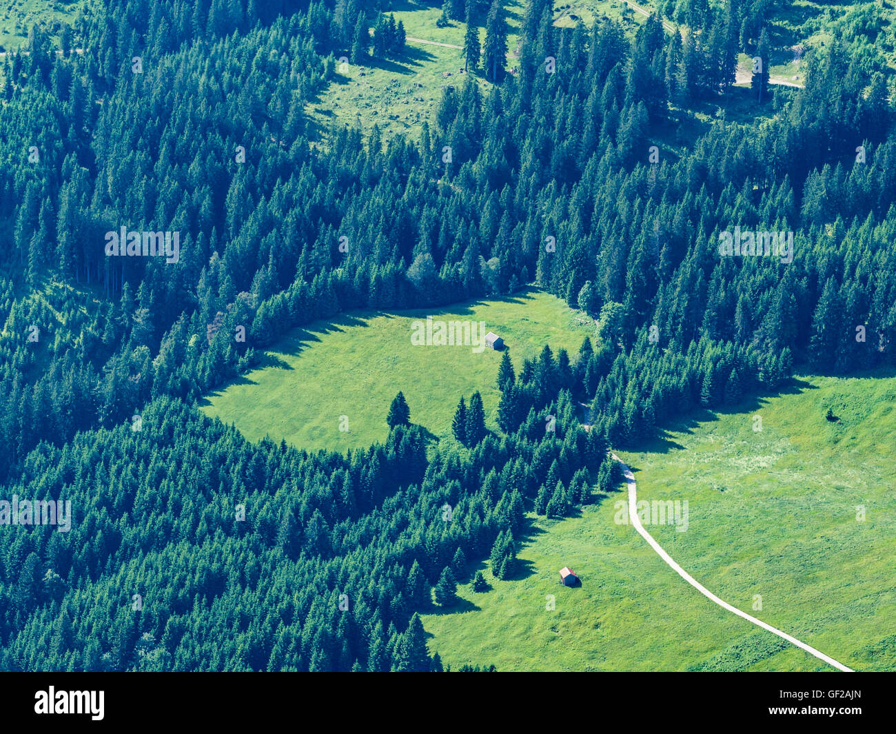 Rural shed on meadow, aerial view, slope of bavarian alps near ...