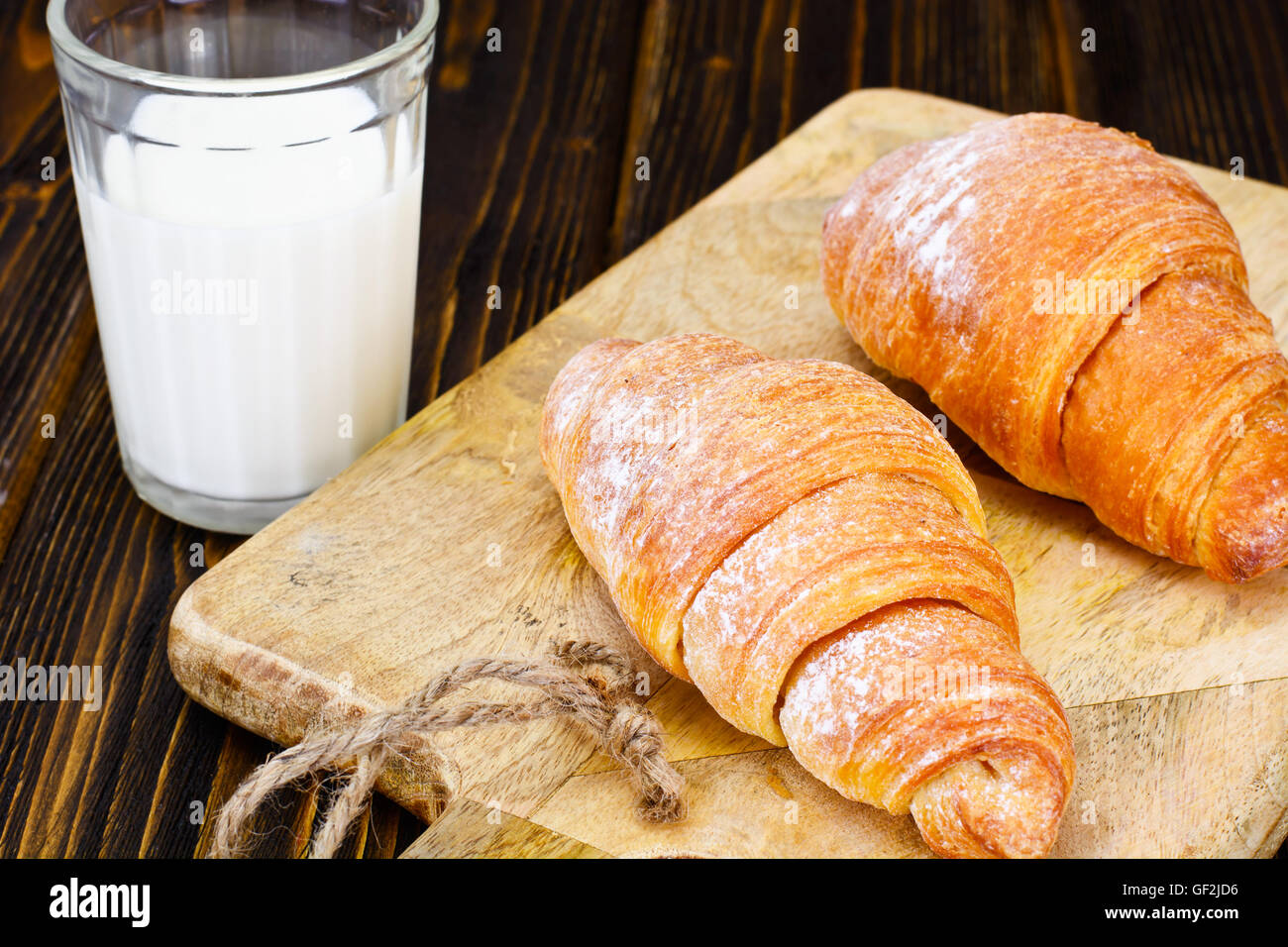 Tasty Sweet Croissant with Milk Stock Photo - Alamy