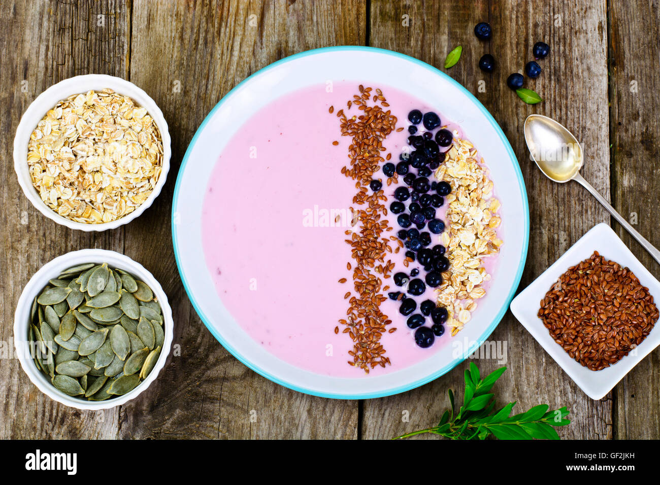 Smoothie with Blueberries, Oatmeal on Brown Boards Stock Photo - Alamy