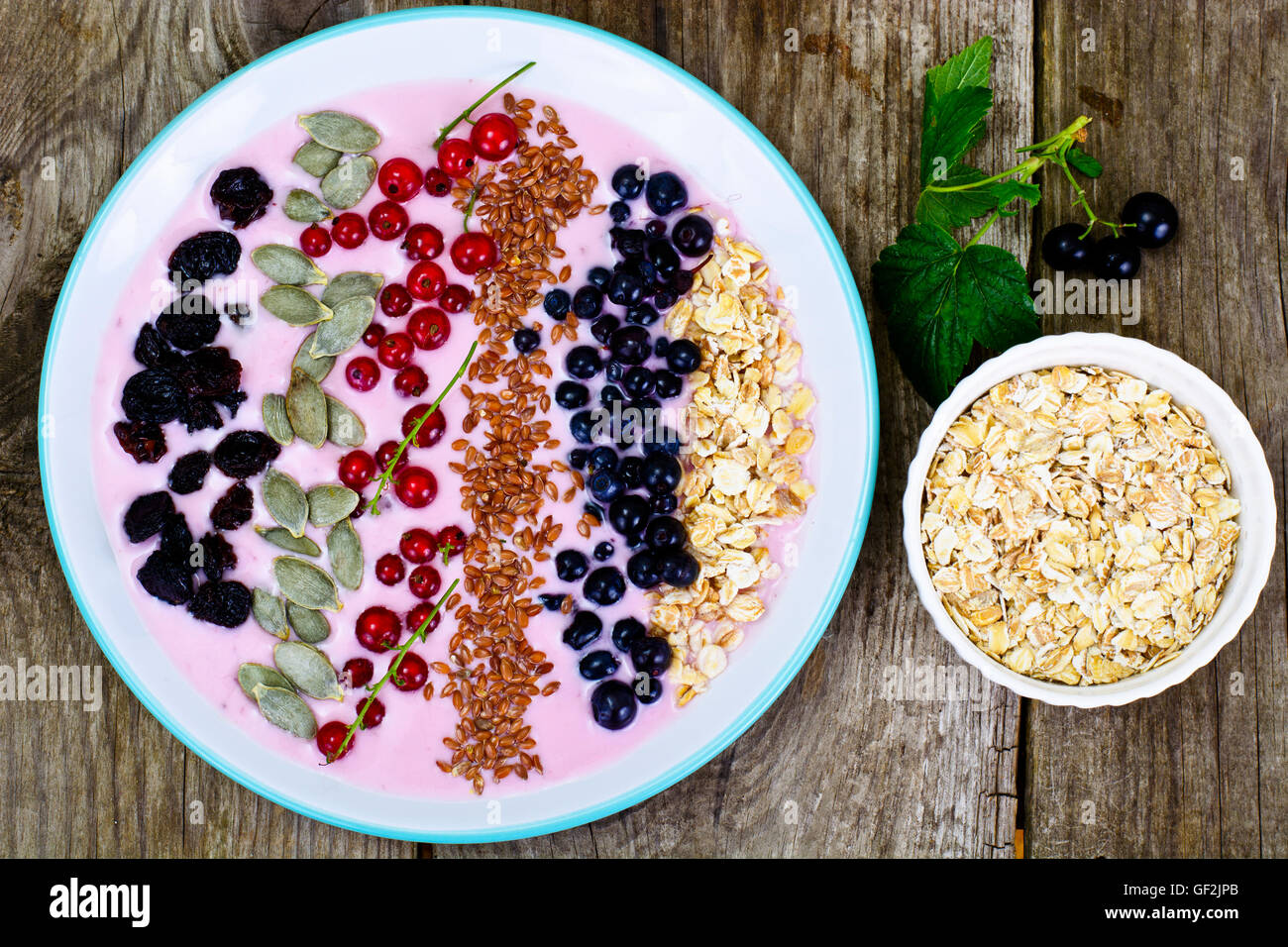 Smoothie with Blueberries, Oatmeal on Brown Boards Stock Photo - Alamy