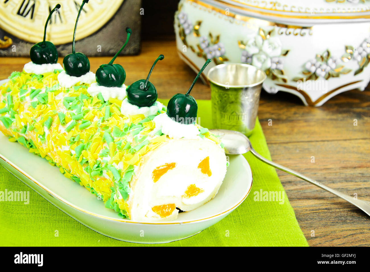 Sponge Roulade with Cream, Mandarin and Cherry Stock Photo - Alamy