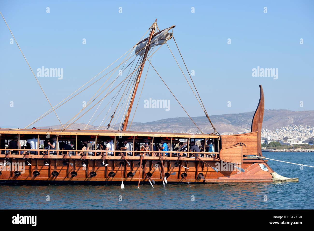 Full scale copy of an ancient trireme with volunteer rowers in Faliro ...