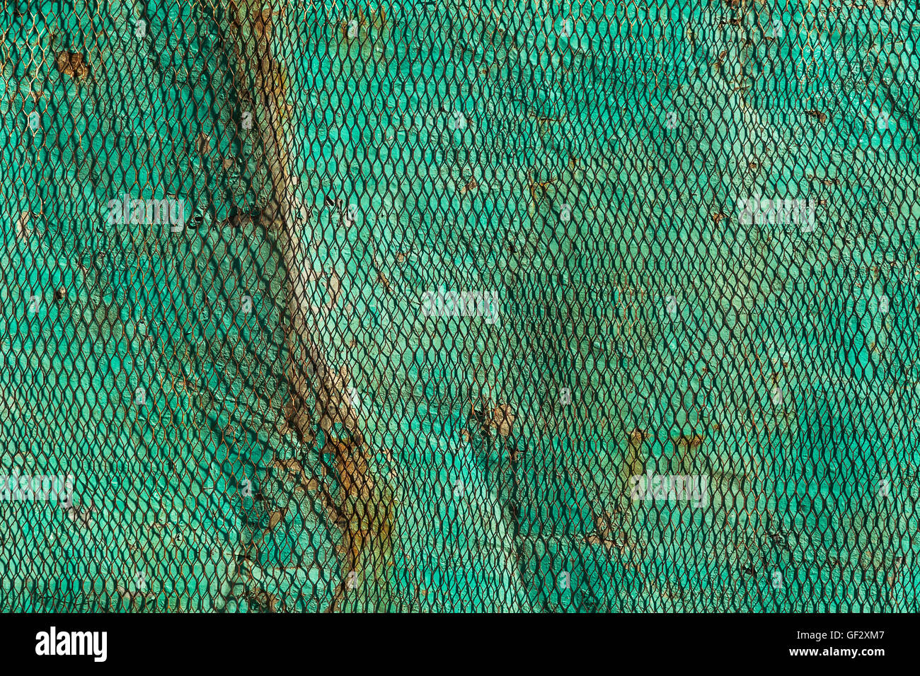 Rusty texture covered with metal mesh Stock Photo - Alamy