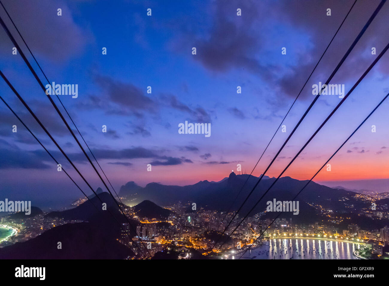 A view of Rio from Sugar Loaf Mountain cable car at sunset Stock Photo ...