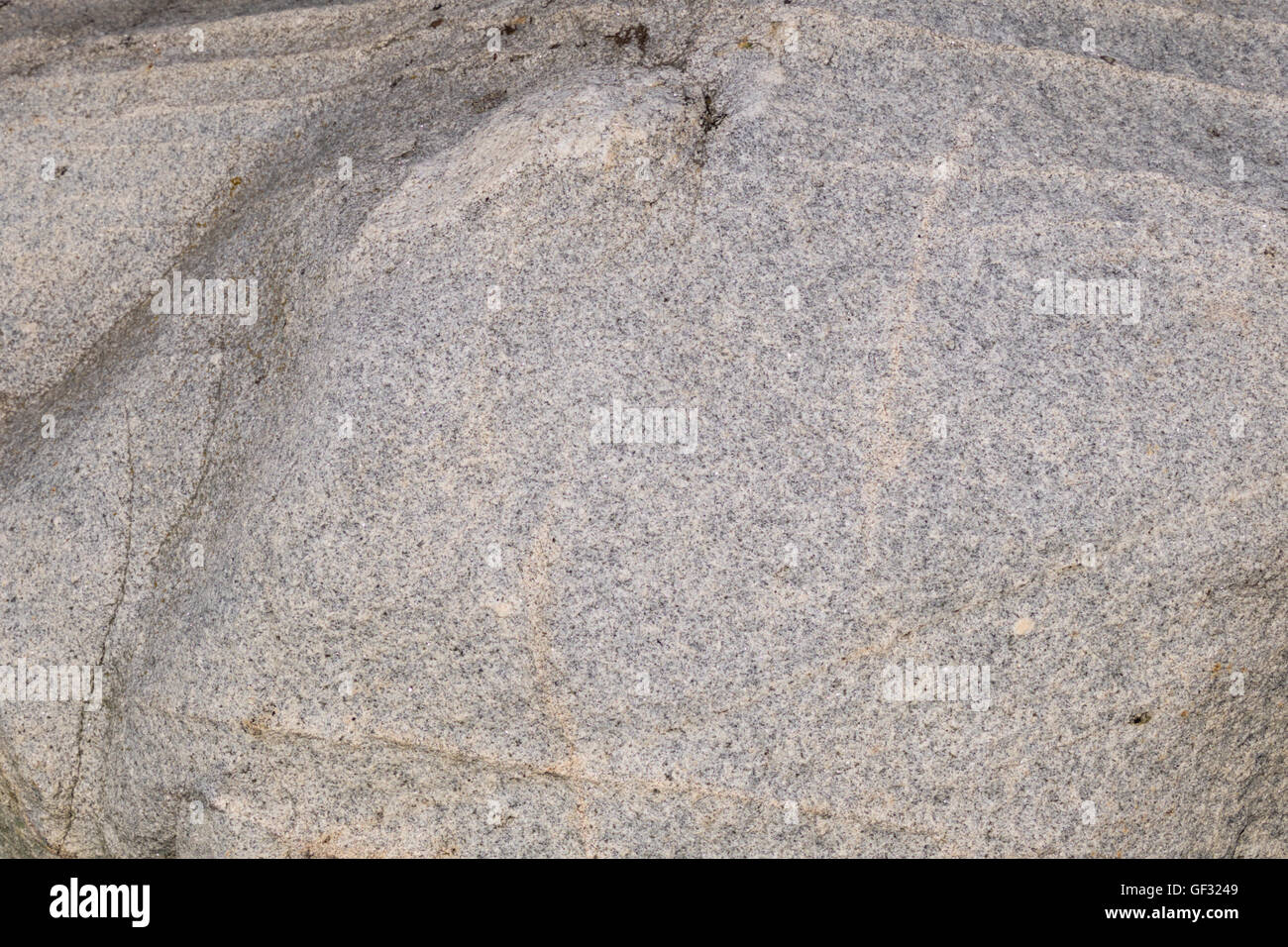 Face of a large granite rock Stock Photo - Alamy