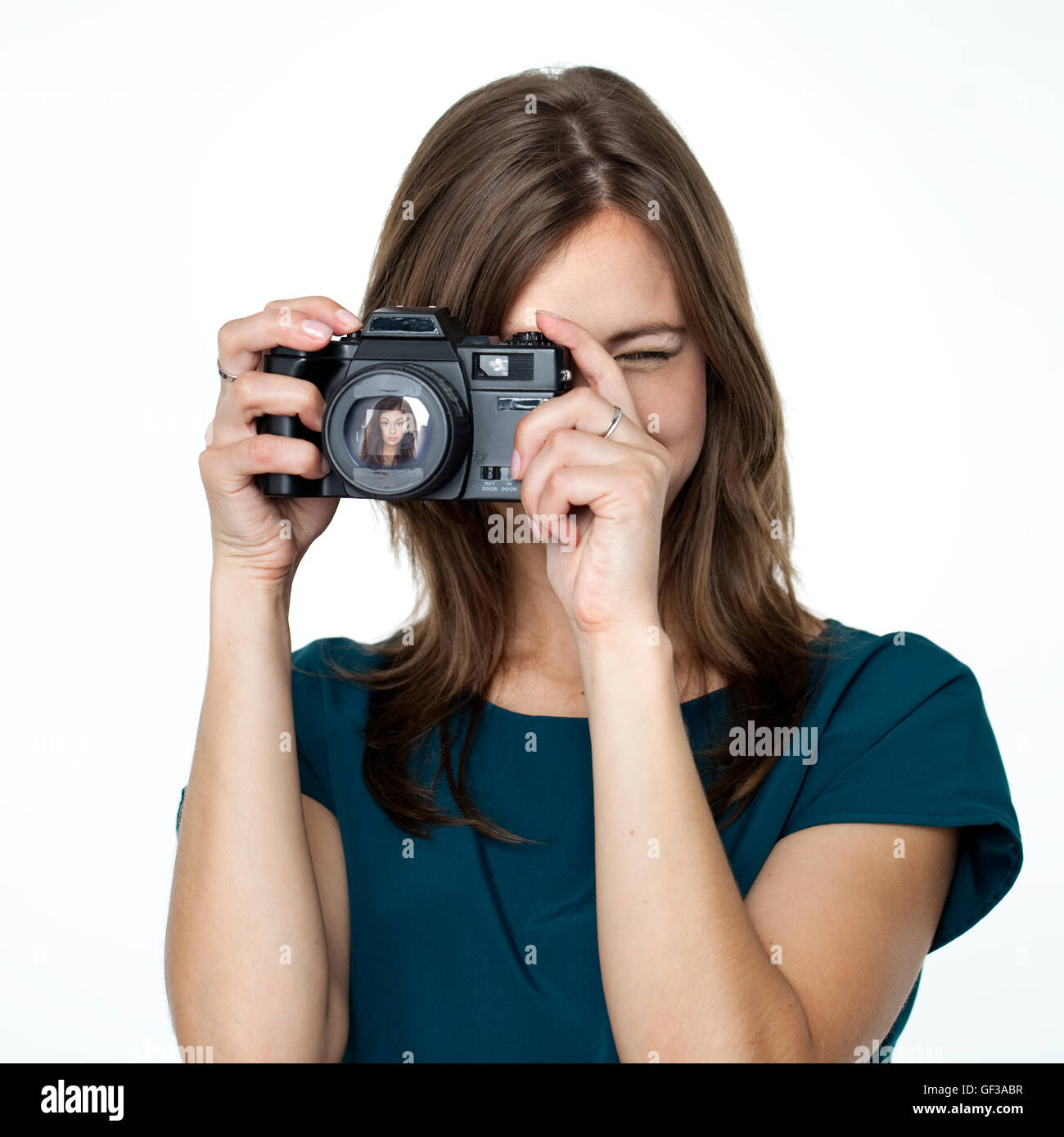 Happy young woman using a camera to take photo, isolated on white Stock ...