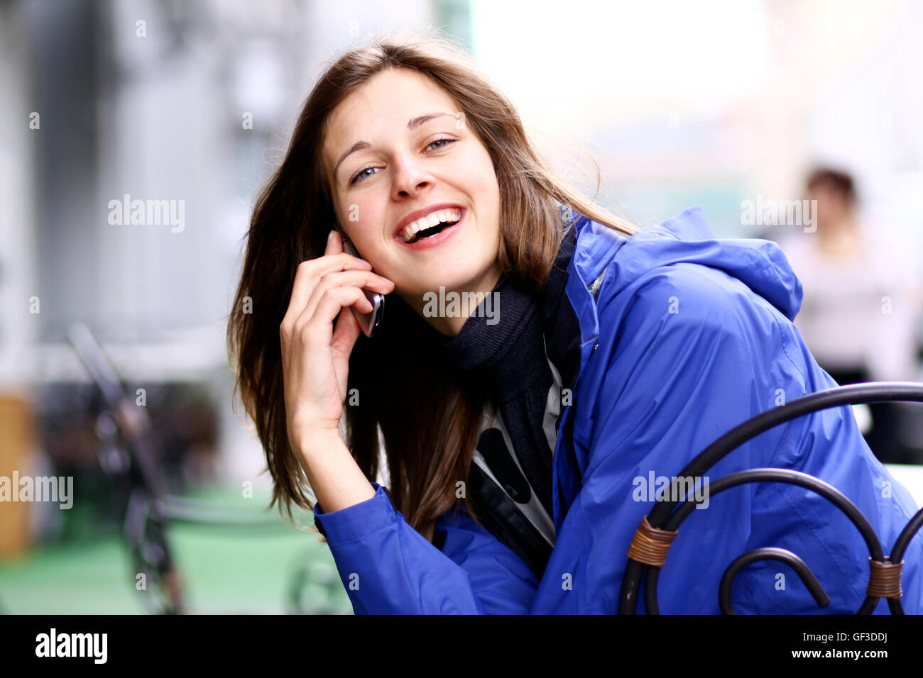 Young happy woman calling by phone on the street Stock Photo - Alamy