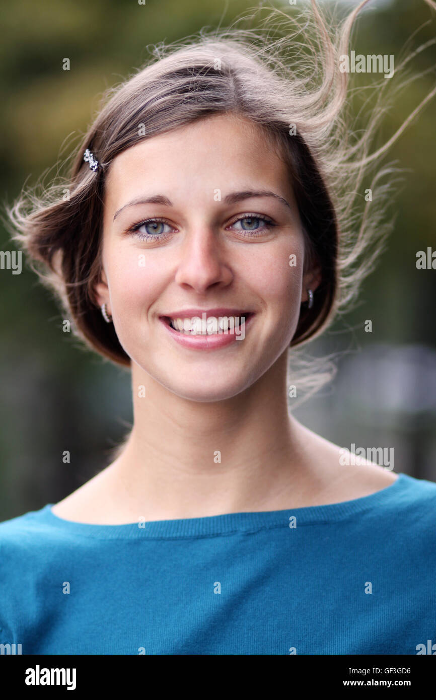 Closeup portrait of a happy young woman smiling Stock Photo - Alamy