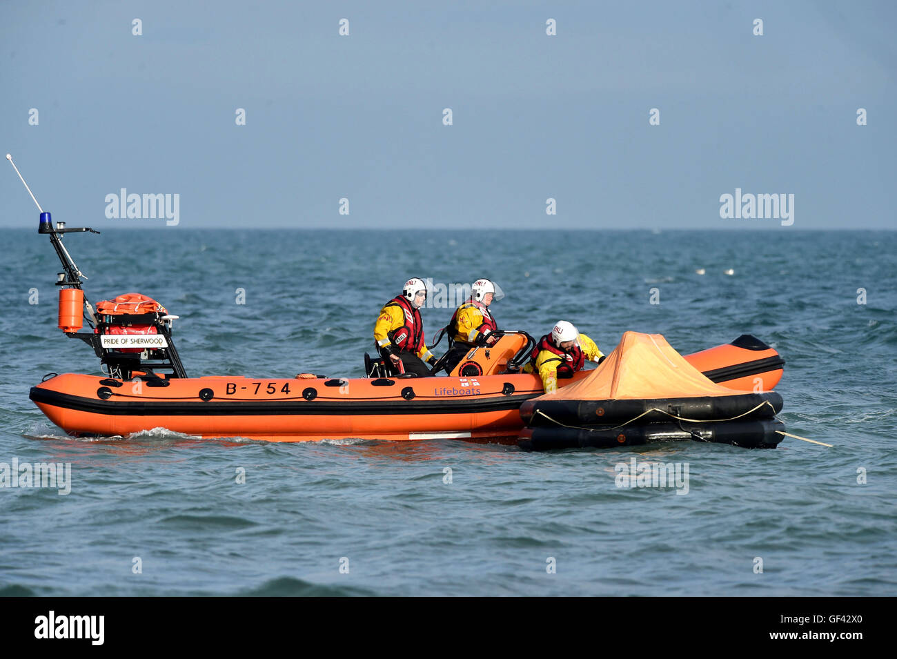 Coastguard Rescue, Inshore Lifeboat rescue of a person from a liferaft ...