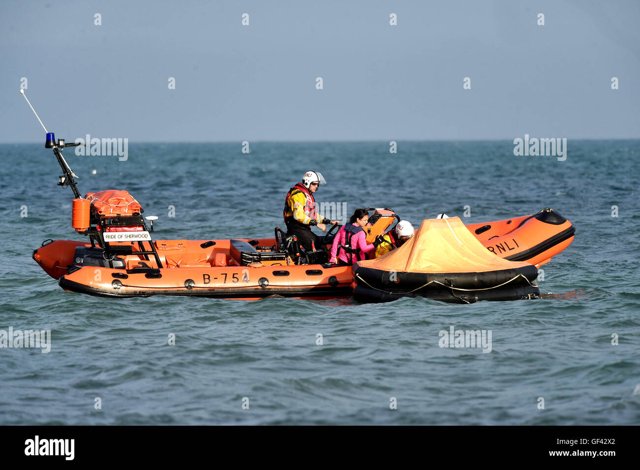 Coastguard Rescue, Inshore Lifeboat rescue of a person from a liferaft ...