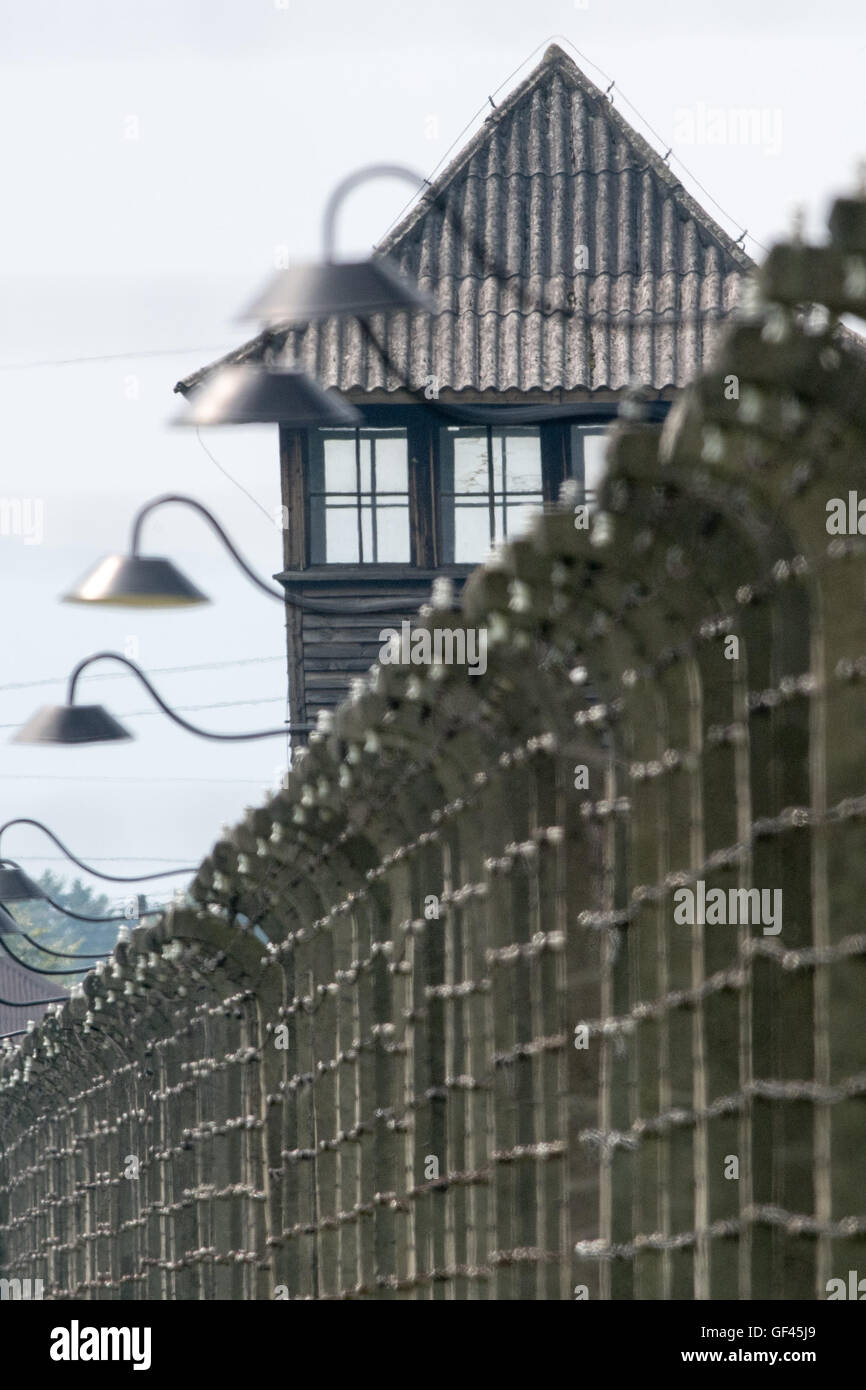 Barbed wire fences and a watchtower are seen on the grounds of the ...