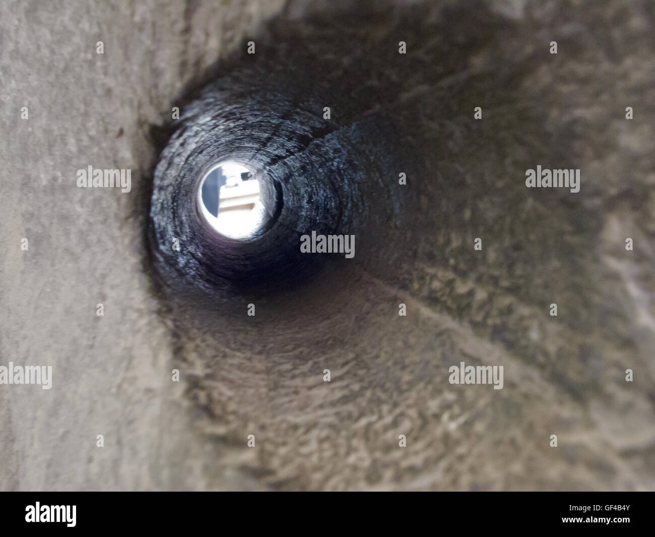 The smooth hole through massive stone block Stock Photo - Alamy