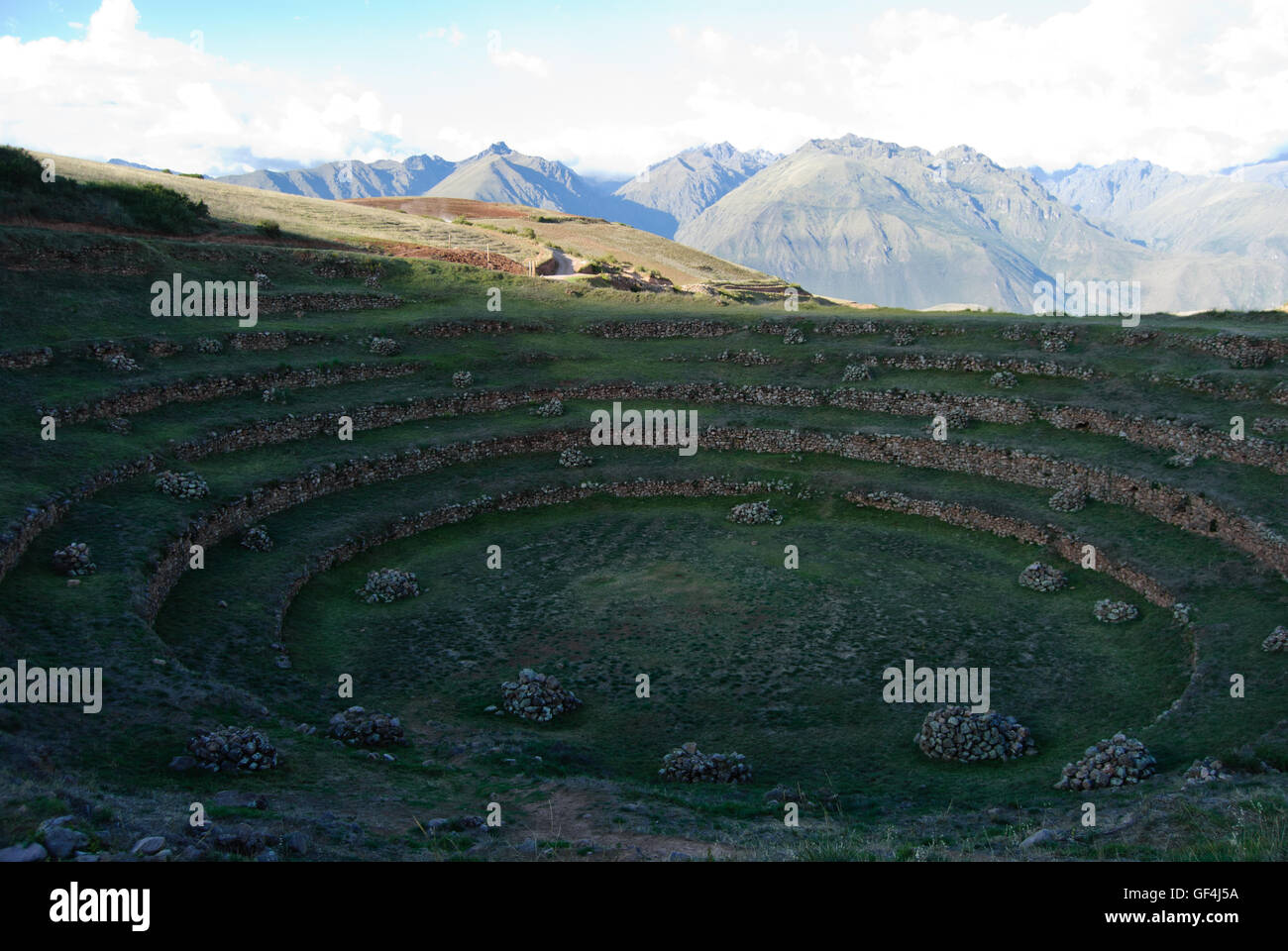 One of the Moray terraces ruins and the Andes mountains Stock Photo - Alamy
