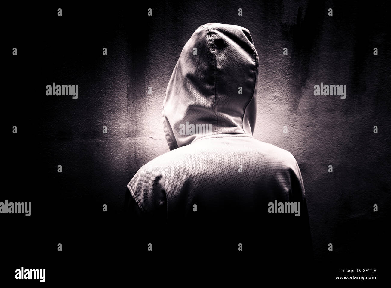 Haunted criminal hiding terrified in hi-res stock photography and ...
