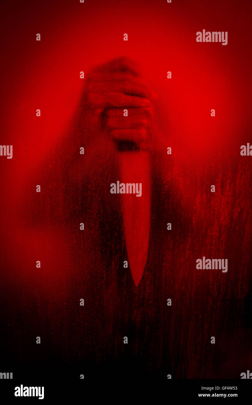 Woman killer with knife behind stained or dirty window glass,Scary ...