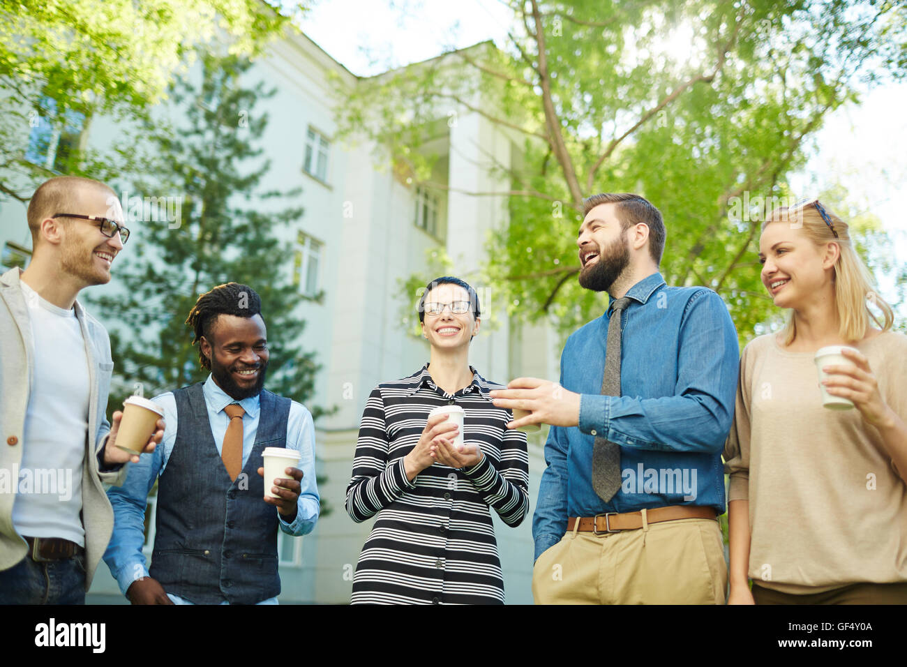 Talking at break Stock Photo - Alamy
